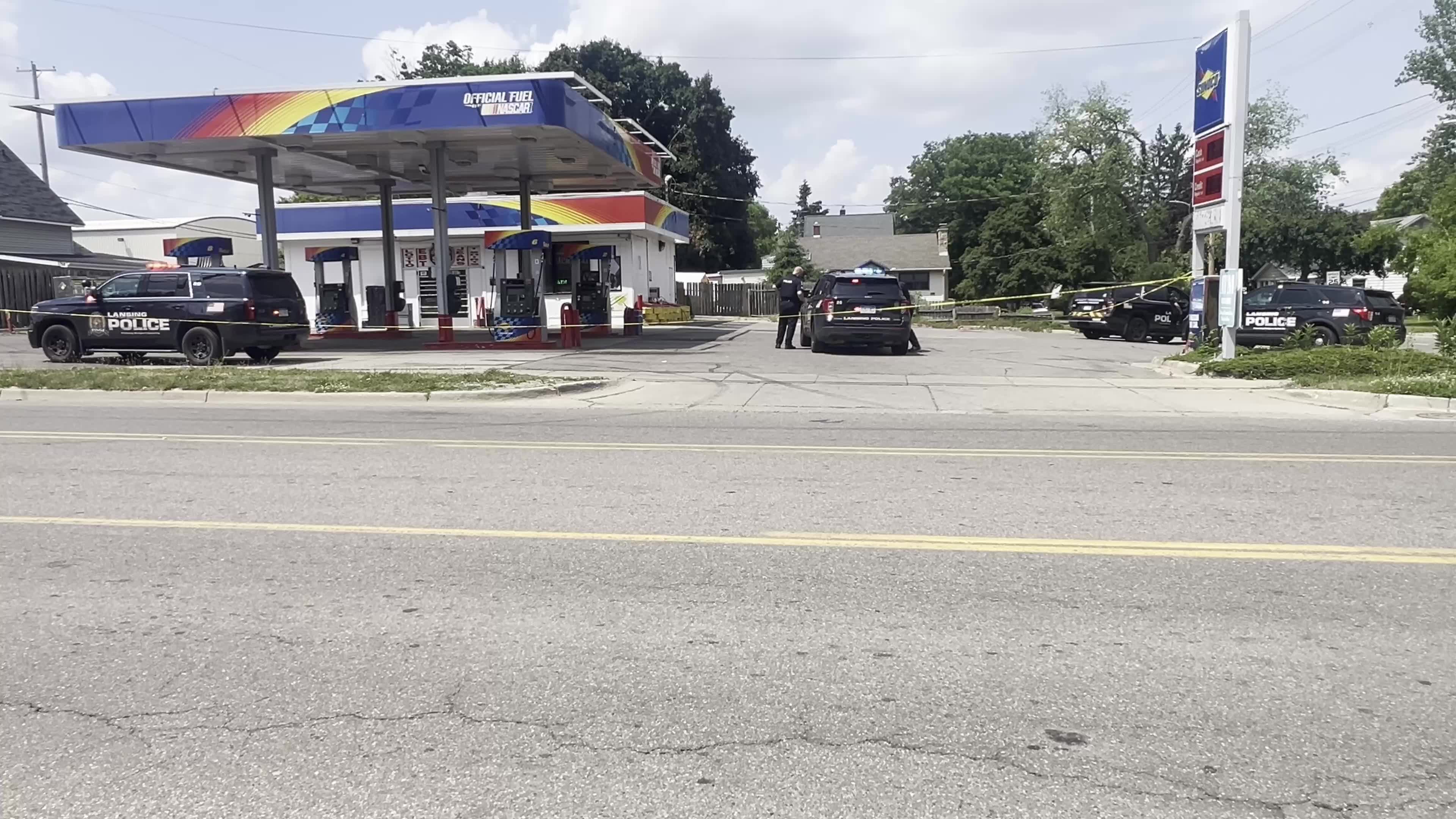Large police presence seen at gas station in Lansing