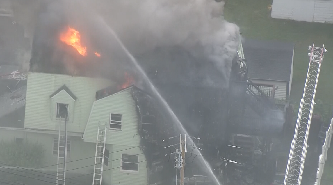 Crews battling large fire at home in Revere, Mass.