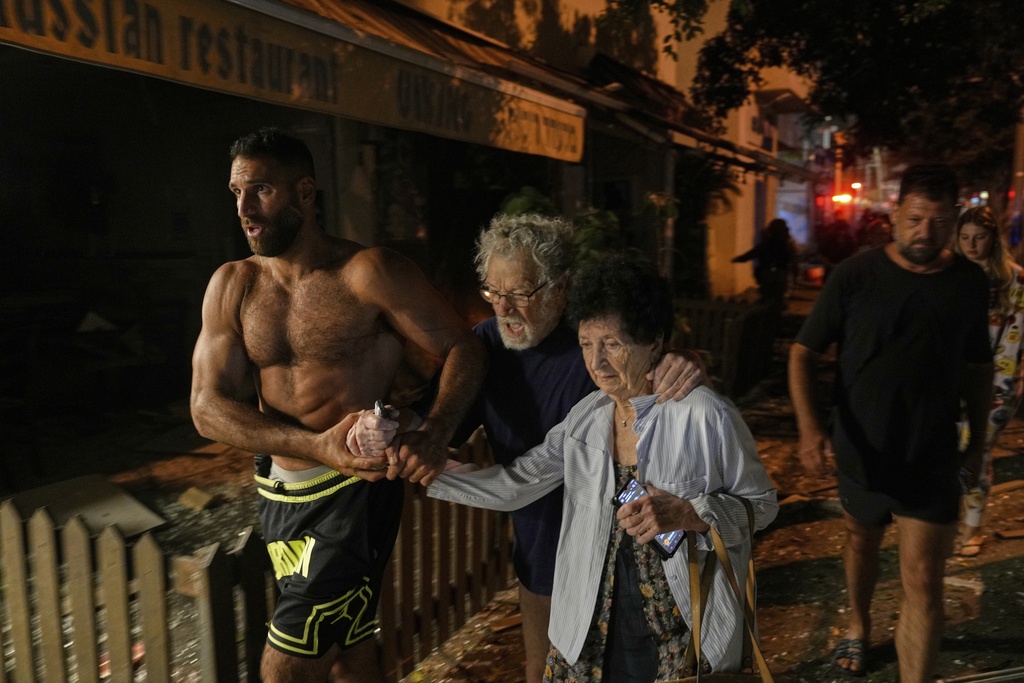 AP photos show dramatic explosions, protests and floods