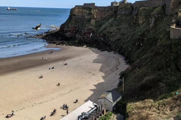 Man in his 20s pulled from sea after getting into 'perilous' position
