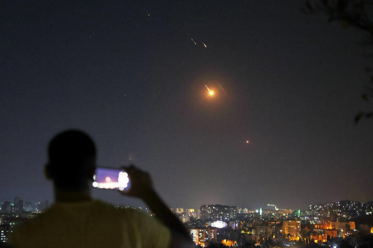 The Latest: Israel strikes Tehran for a sixth day as Iranian casualties ...