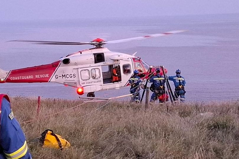 Walker falls 60ft down cliff after landslide near Seaton