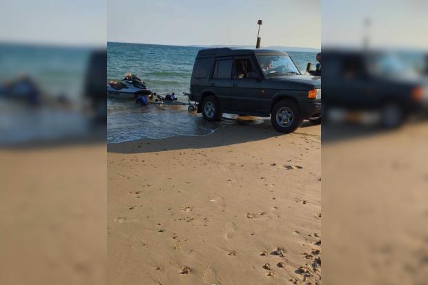 Another car ends up stranded on the beach