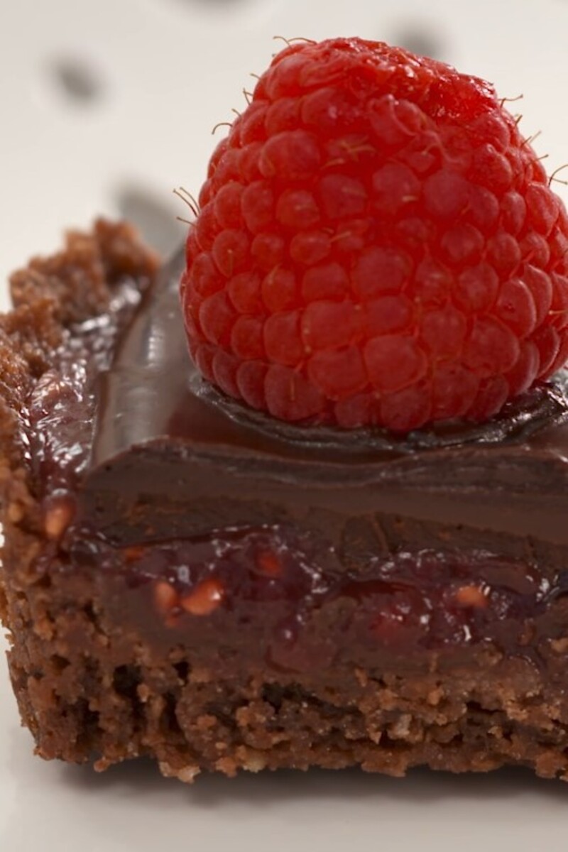 Raspberry chocolate ganache torte with crispy wafer base