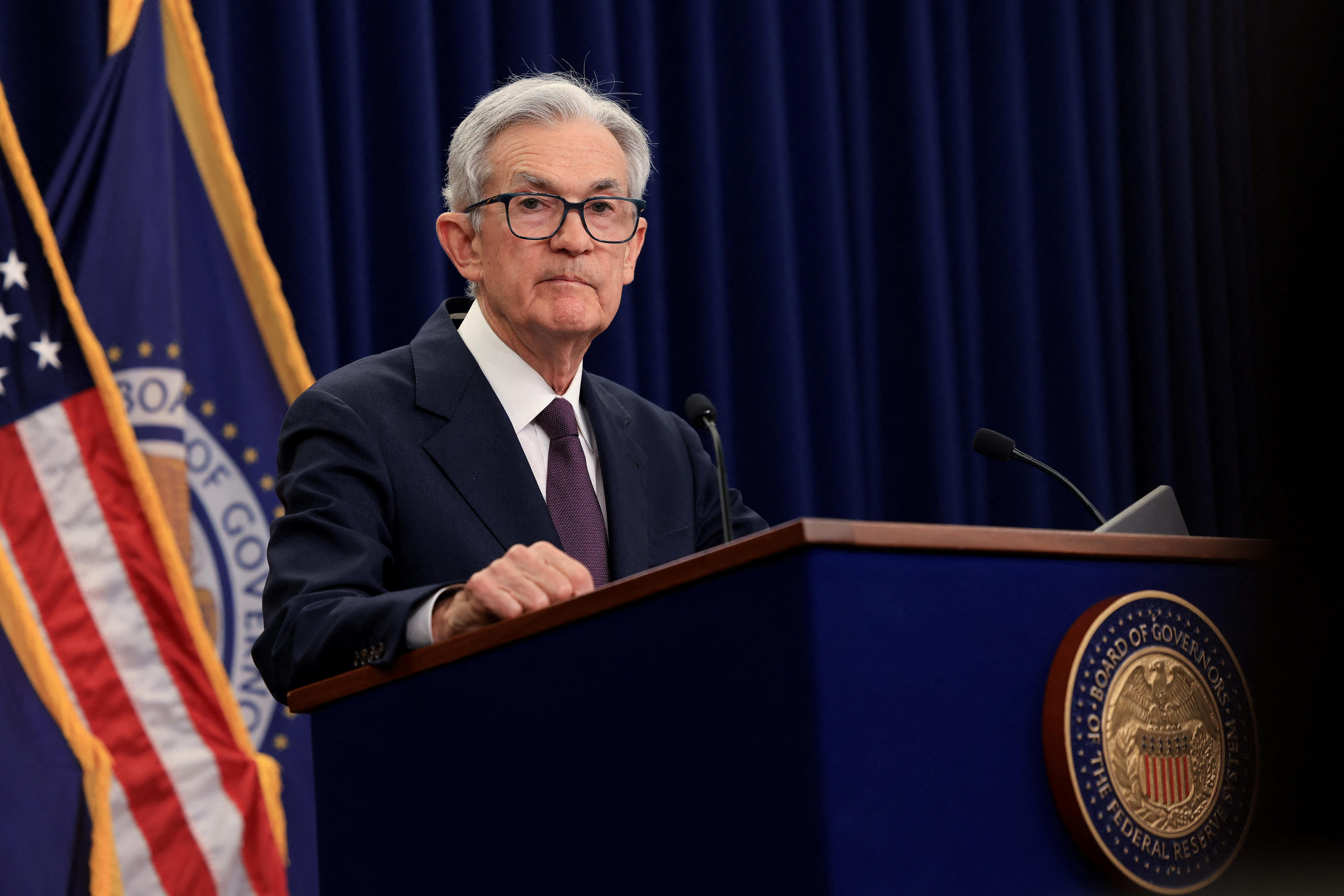Fed holds rates steady, eyes Trump tariff risks and inflation