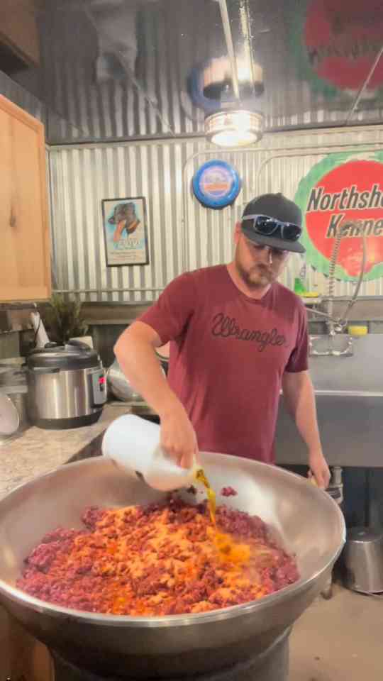 Man is making breakfast for thirty-four greyhounds!
