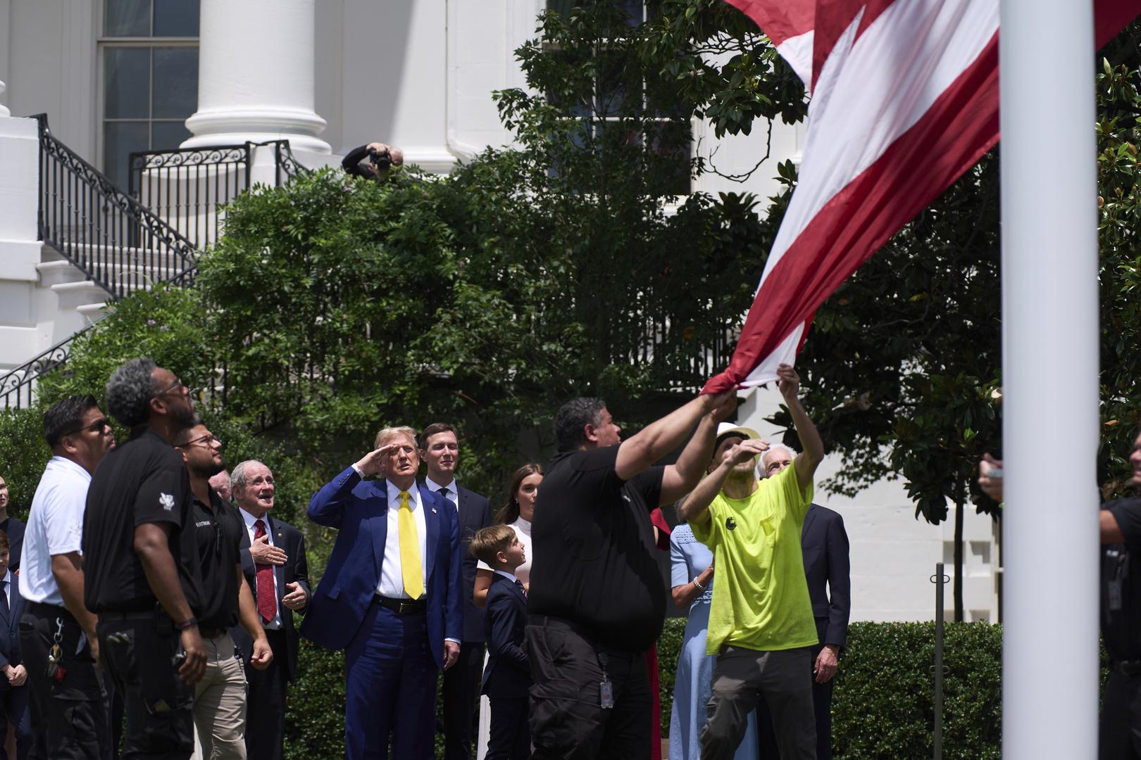 Trump salutes U.S. flag raised on new pole at the White House