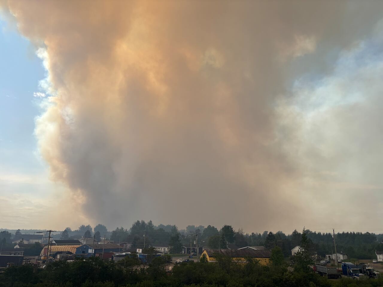 Badger fire downgraded in scale, but still burning near community
