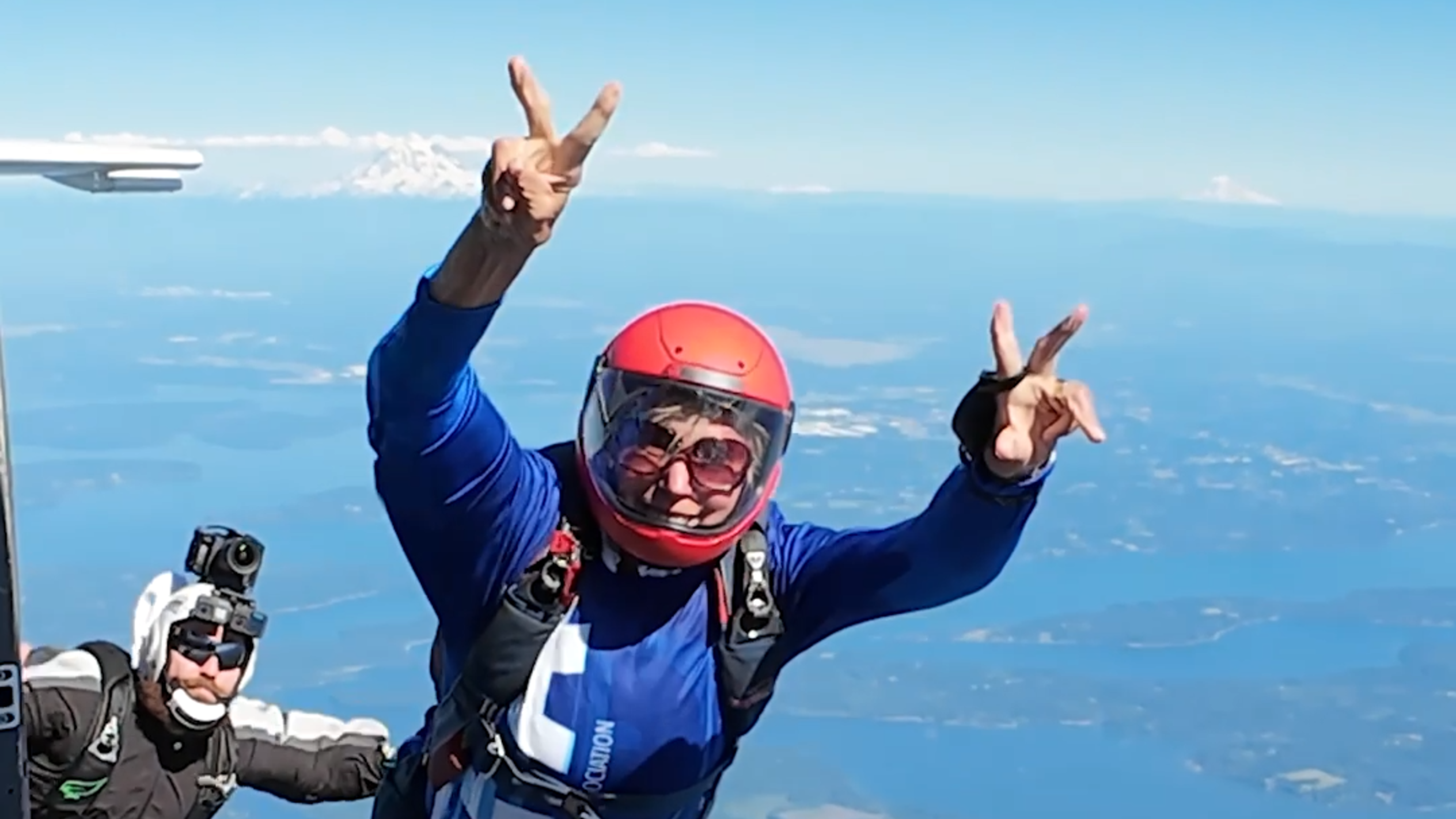 Watch world-record holding 75-year-old Washington grandma jump out of a ...