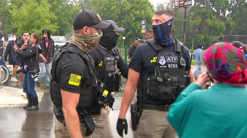 Why did federal agents wear masks during the south Minneapolis raid?