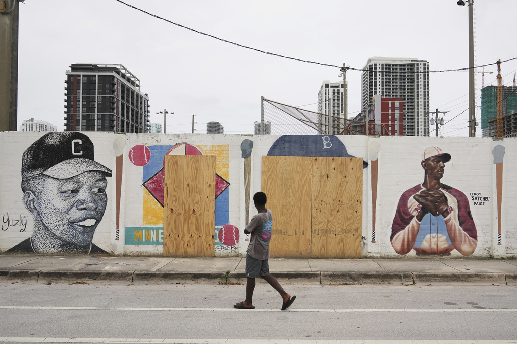 A mural honoring Jackie Robinson and Minnie Miñoso is defaced with ...