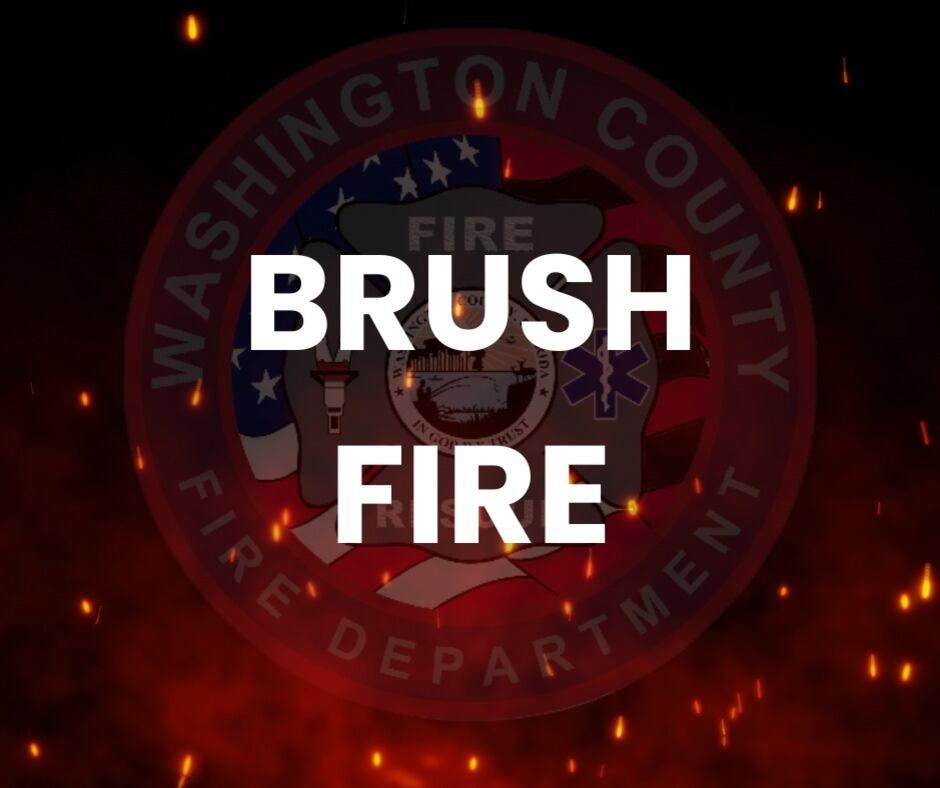 Fire crews working to contain a brush fire in Washington County