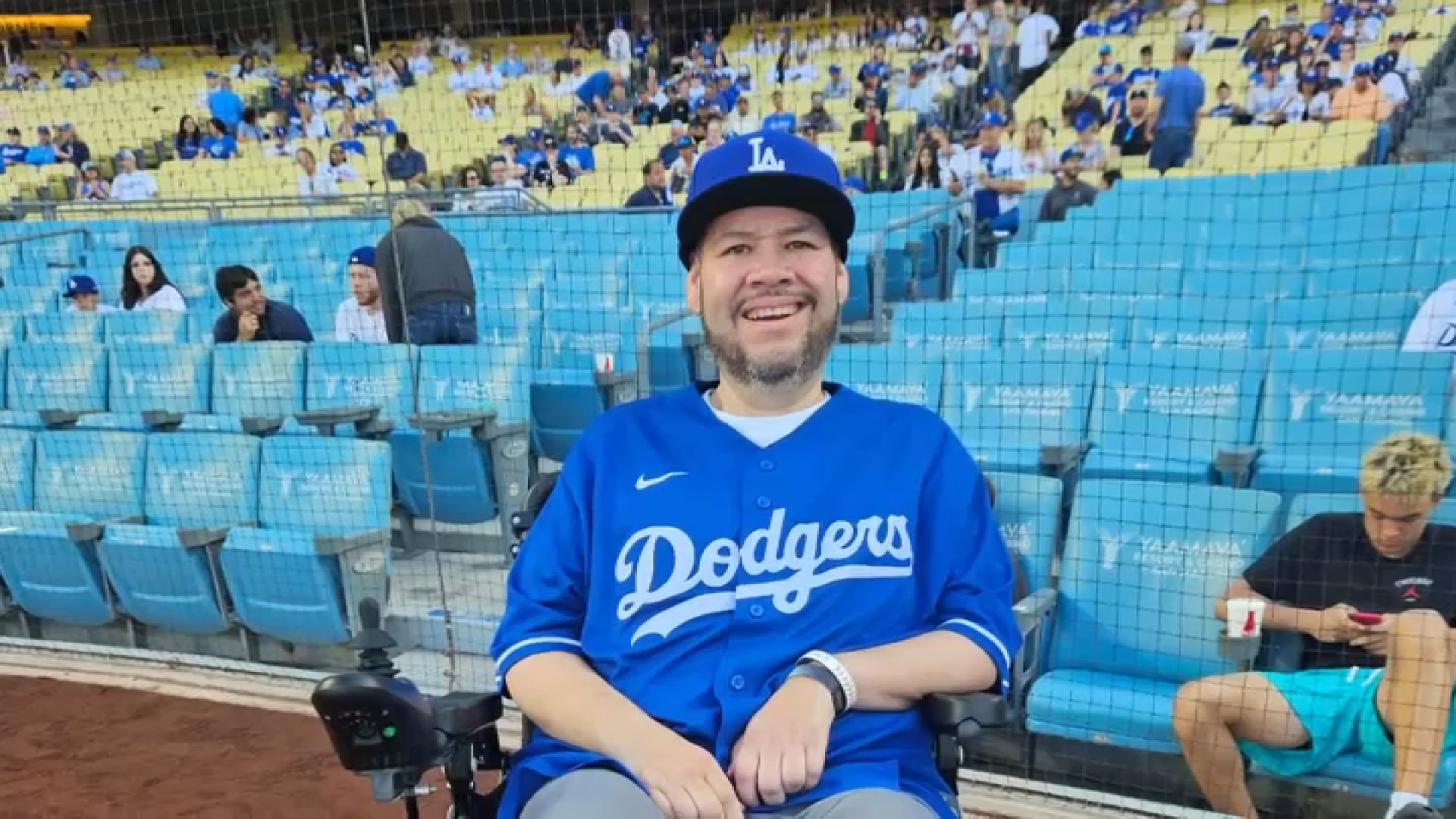 High school coach battling ALS honored, gifted wheelchair by LA Dodgers