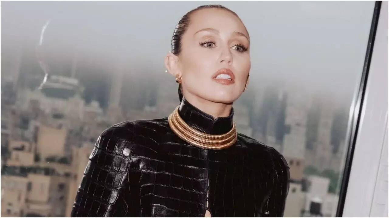 Miley Cyrus in completely sheer black dress stuns fans as she signs ...