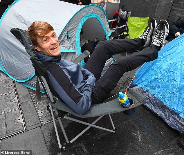 Teenagers camp out and brave 15 hour queues in the pouring rain to get ...