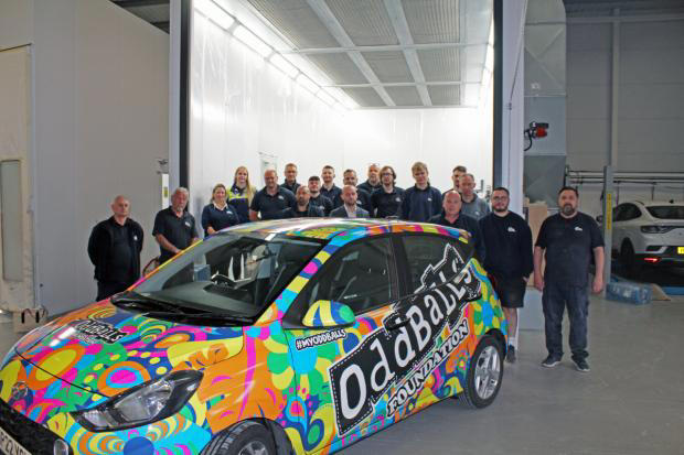 Auto repair company donates £1,000 to men's health charity