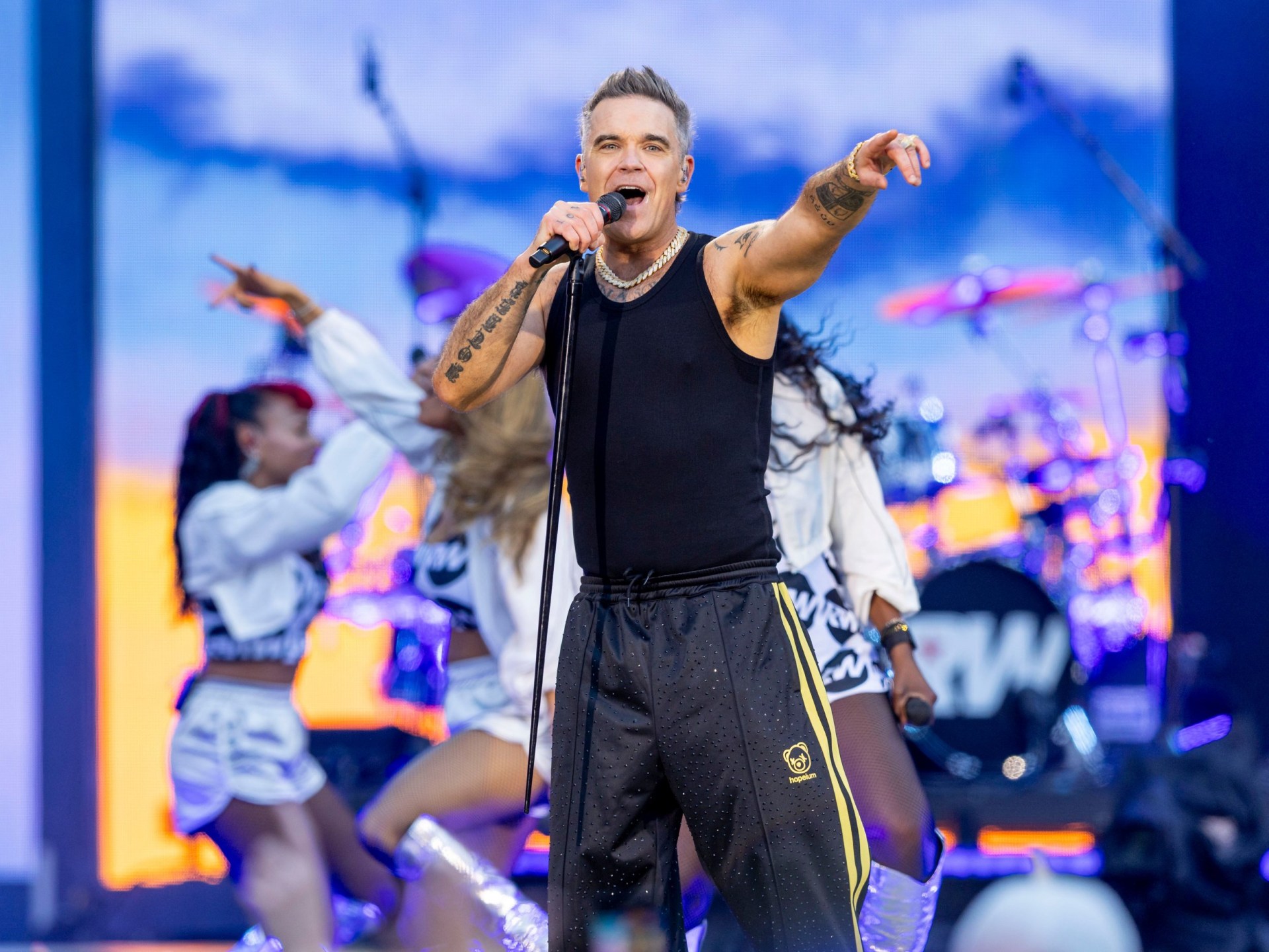 Iconic band reunite on stage after 25 years during Robbie Williams gig