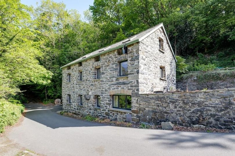 This former mill packed with character and surrounded by woodland has a ...