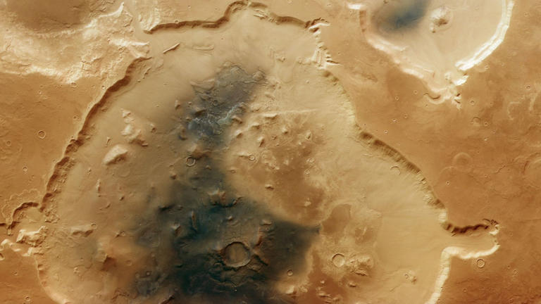 European Mars orbiter spies crumbling crater 'soaked in layers of ...