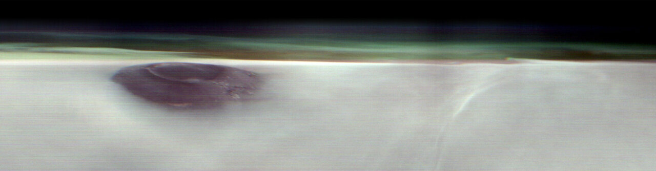 Mars Odyssey orbiter captures volcano peeking above morning cloud tops