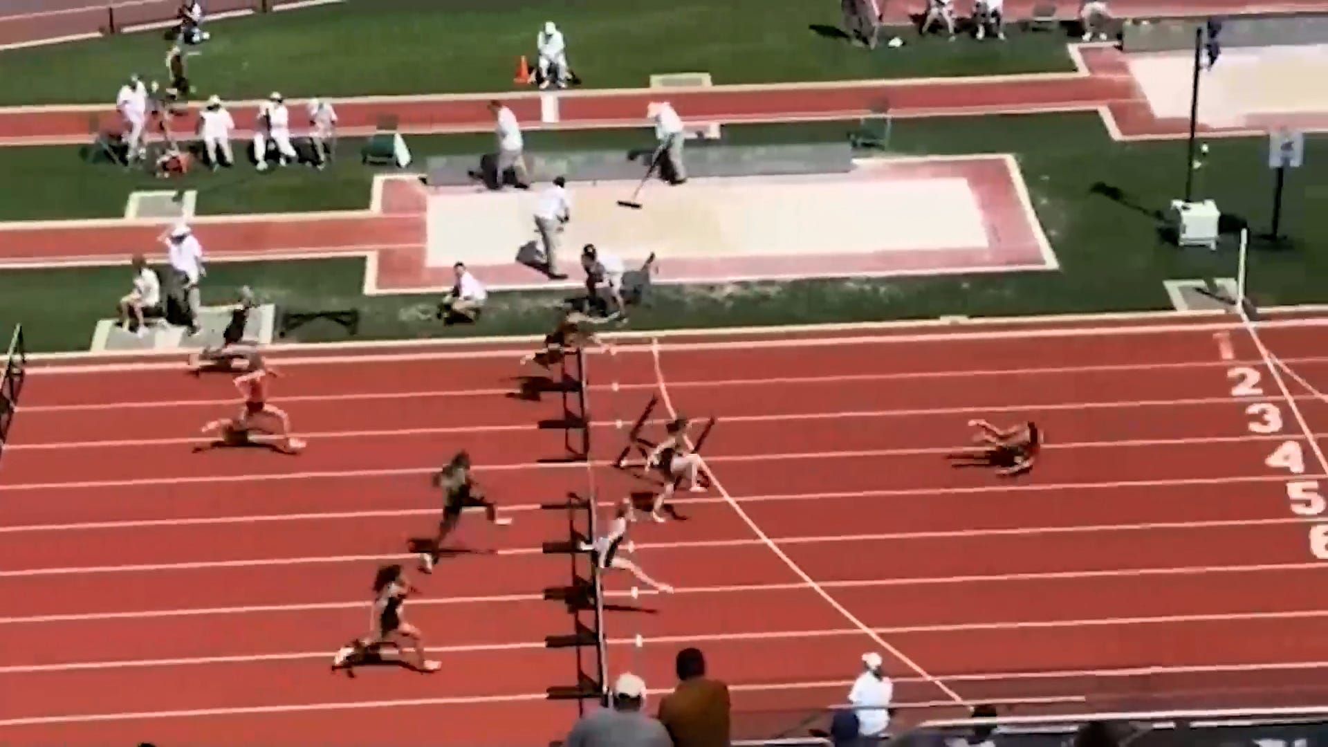 Watch Oregon high school track star somersault over finish line, win ...