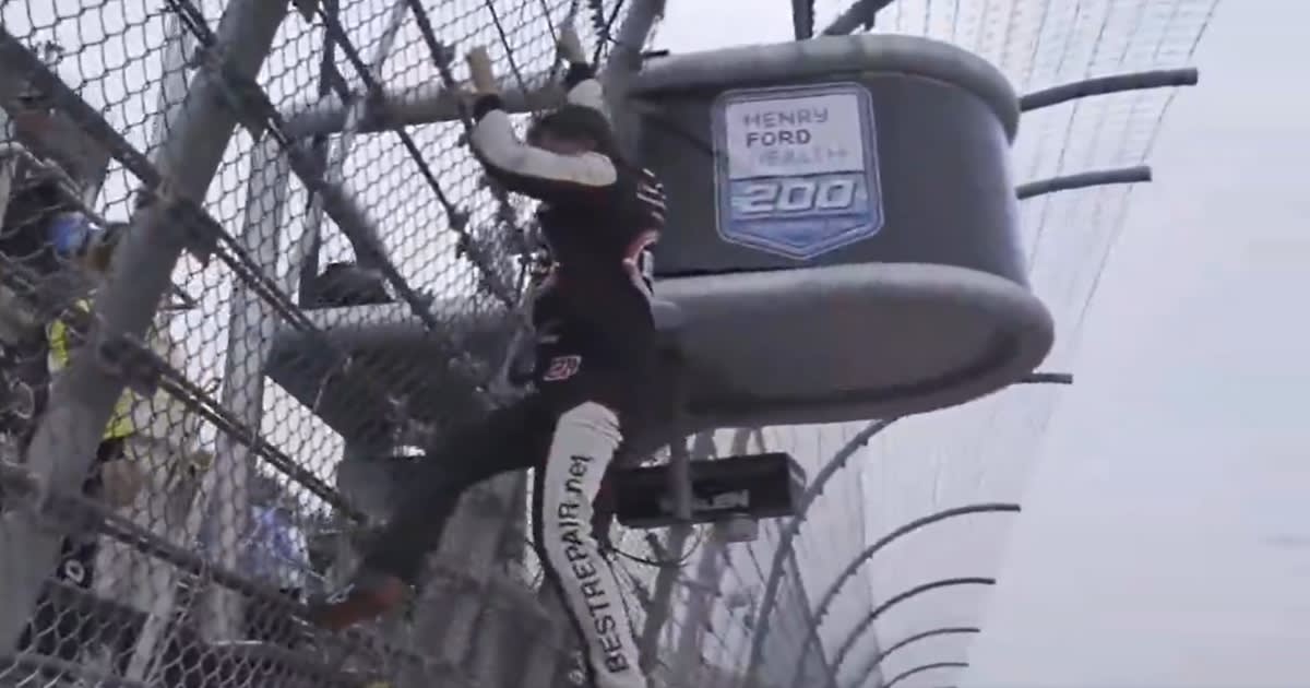 Brenden ‘Butterbean’ Queen climbs the fence at Michigan to celebrate ...