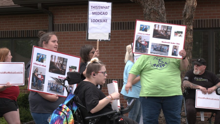 Activists protest possible Medicaid cuts outside KS Rep. Derek Schmidt ...
