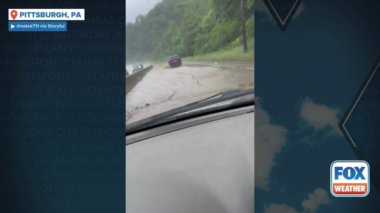 Cars drive through flash flooding in Pittsburgh