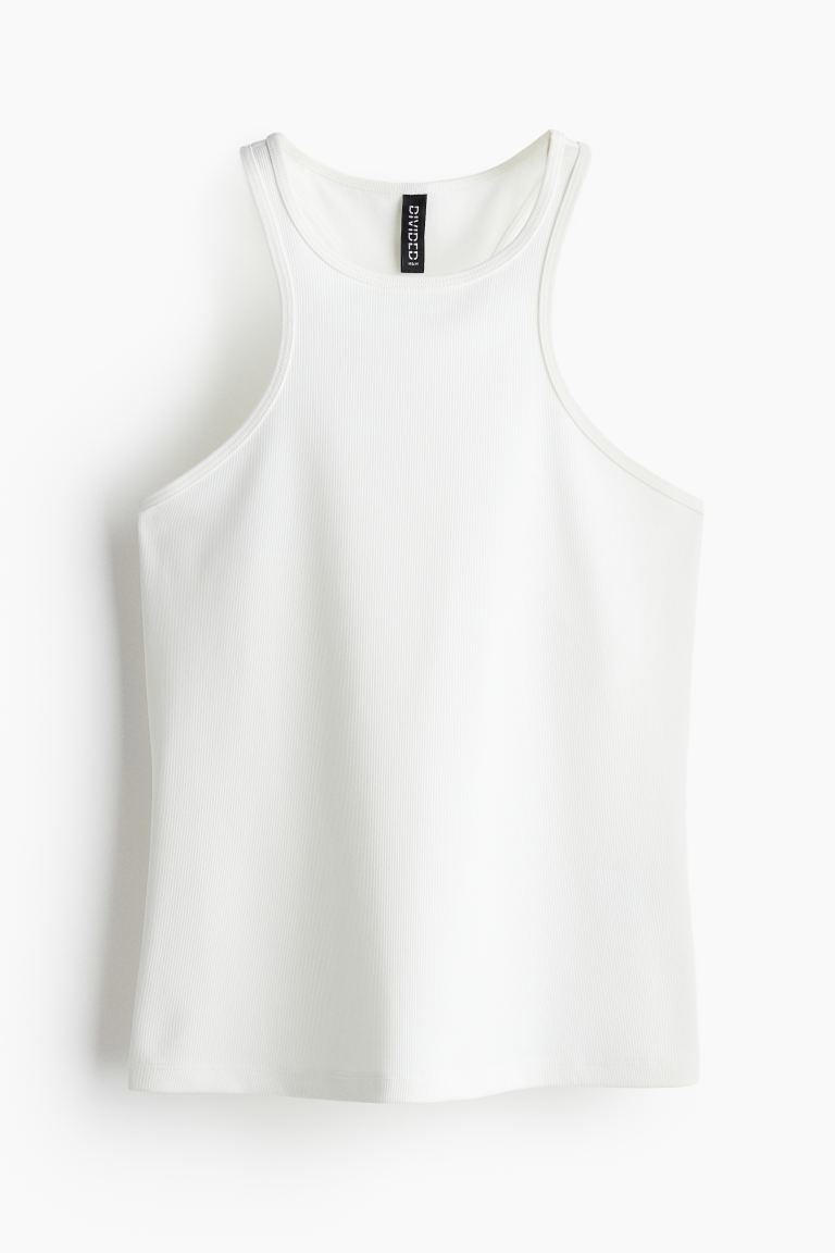 4 Outfit Ideas to Make the Humble White Tank Top Look Straight-Up Chic
