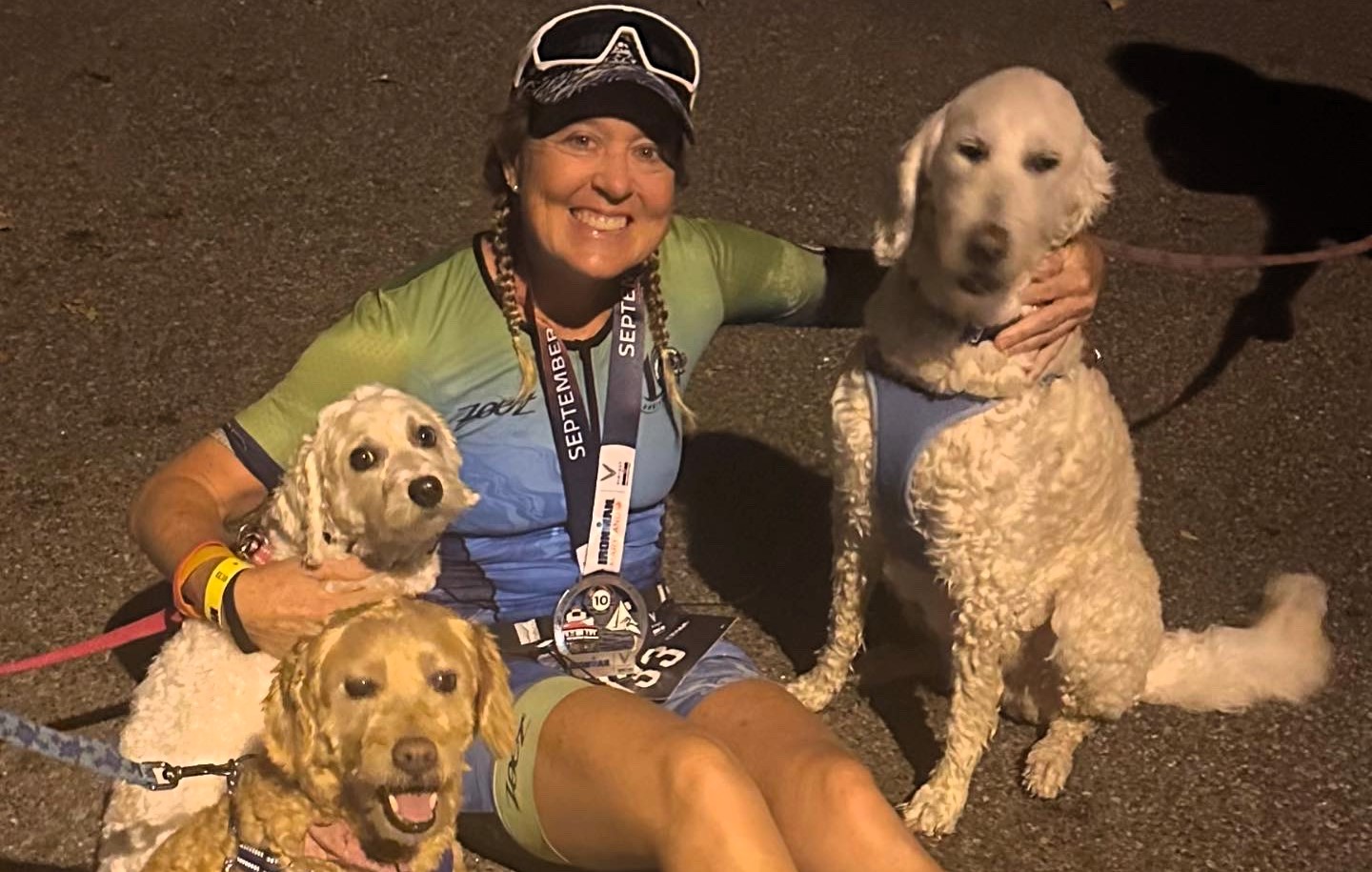 She’s completed 99 Ironman races. Her motivation? Petting dogs mid-race.