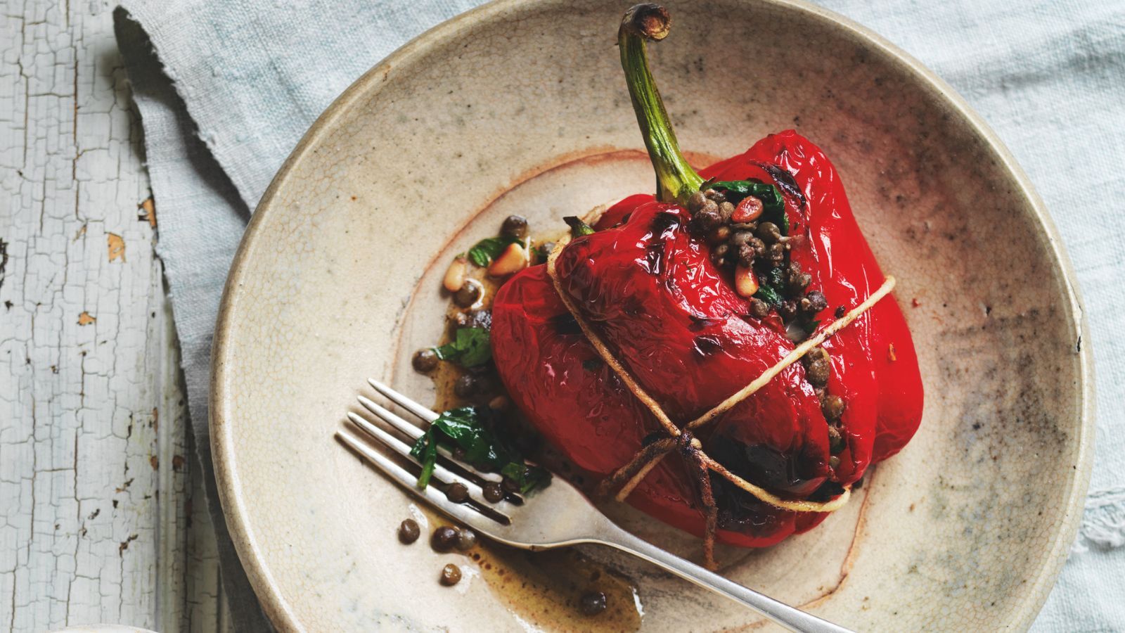 Stuffed peppers just got a bold upgrade with this harissa yogurt recipe