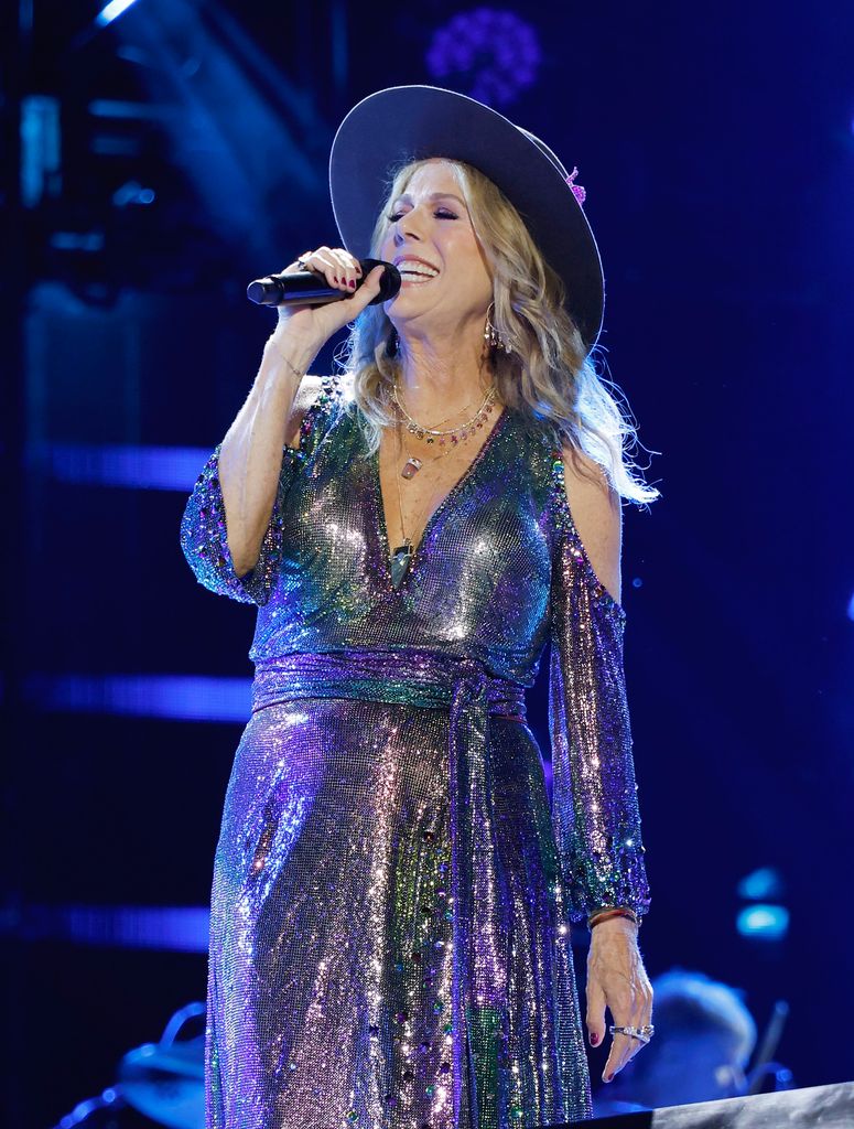 Rita Wilson, 68, rocks slinky deep V-neck dress with thigh-high split ...