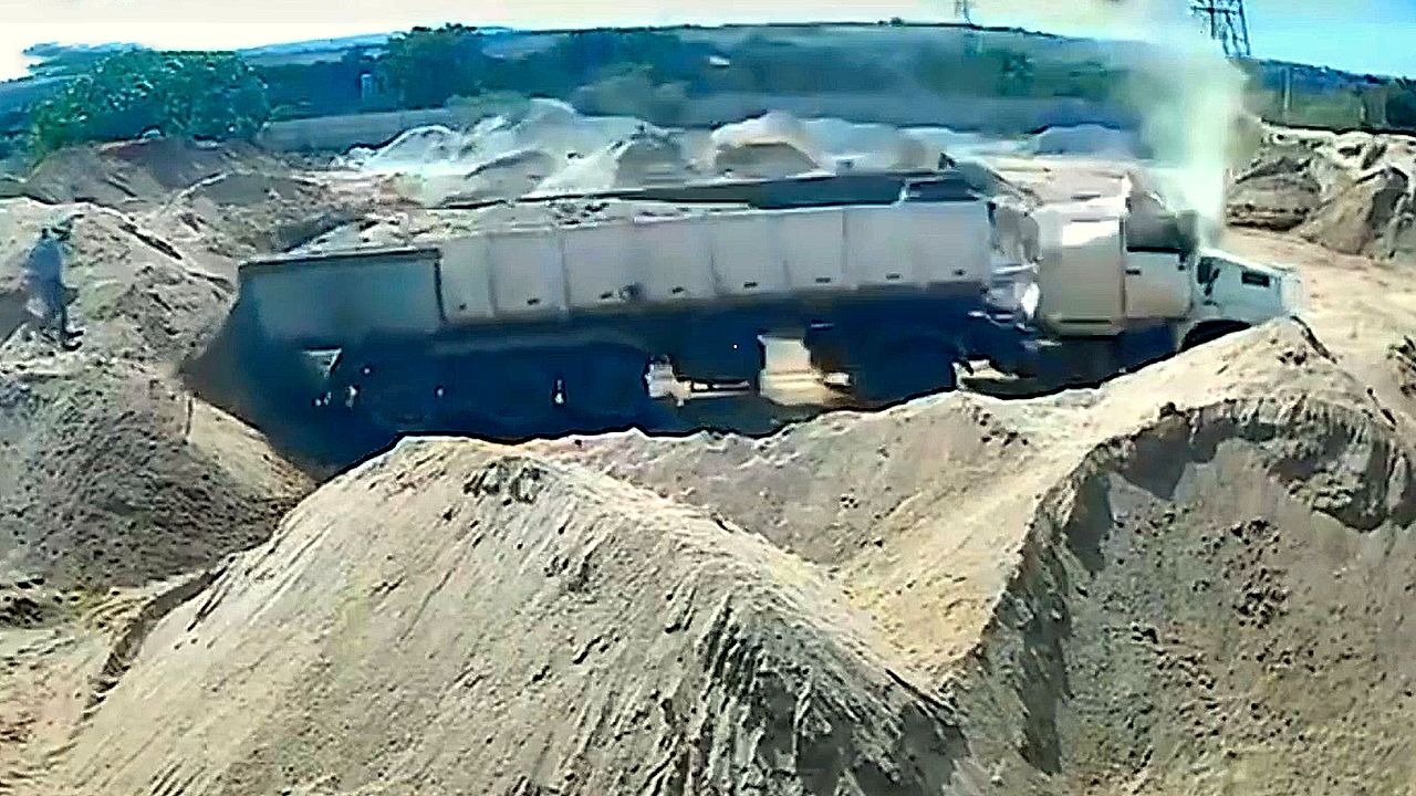 Truck driver miraculously survives after cabin is crushed by falling ...