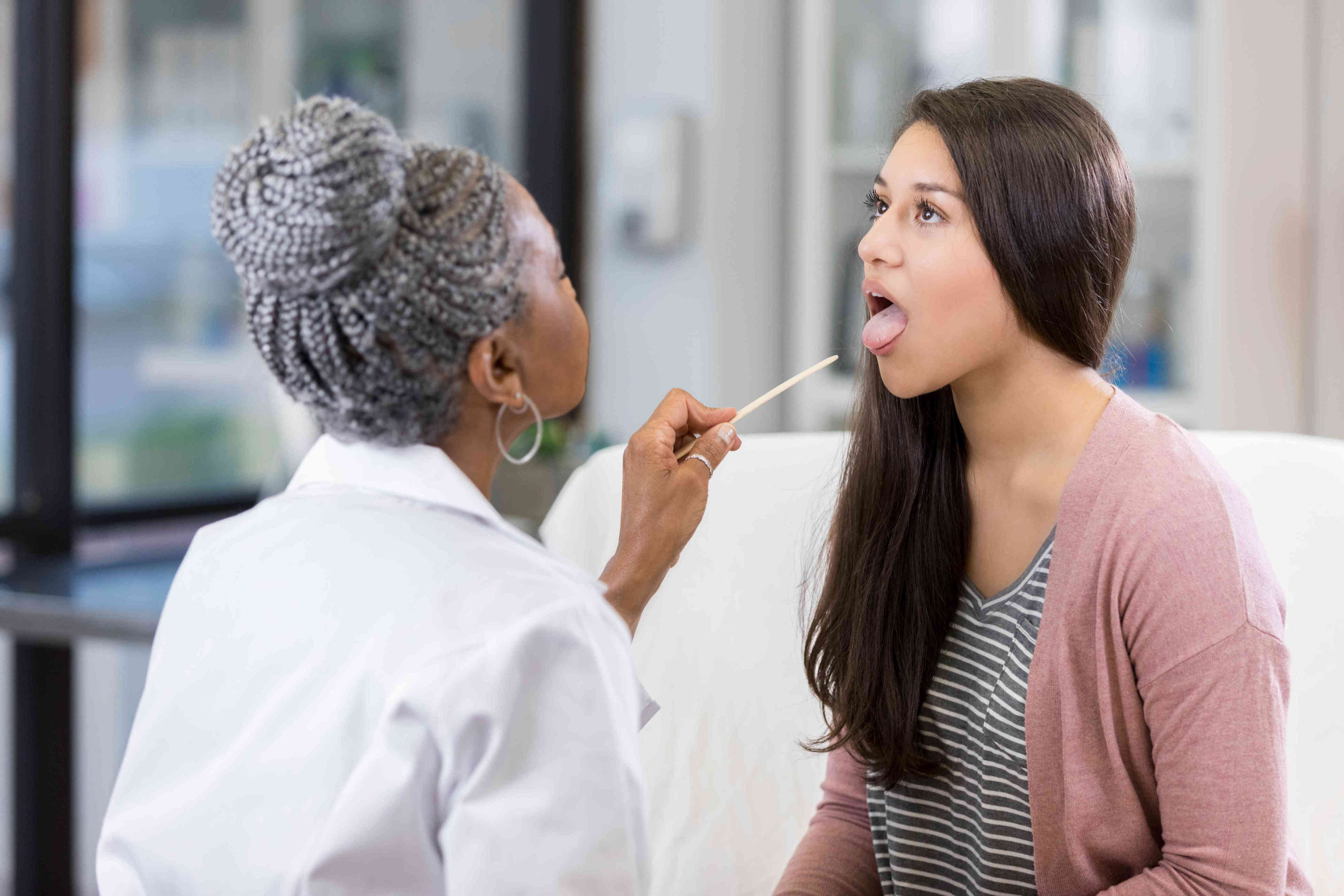 What causes dark black spots on the tongue?