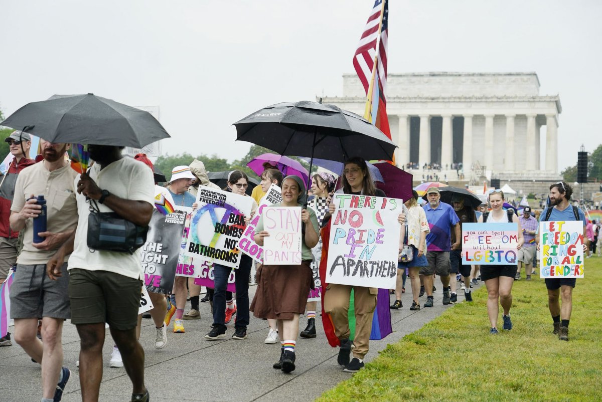 Marchers rally on the National Mall for WorldPride 2025