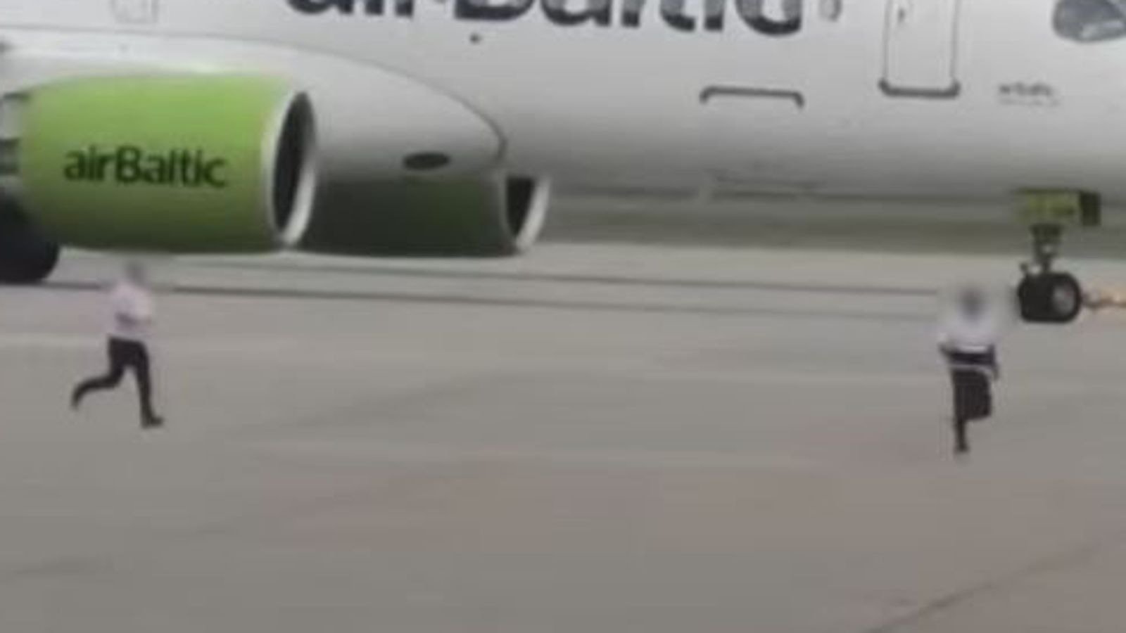 Bizarre moment plane-spotter filmed man running around on Heathrow runway