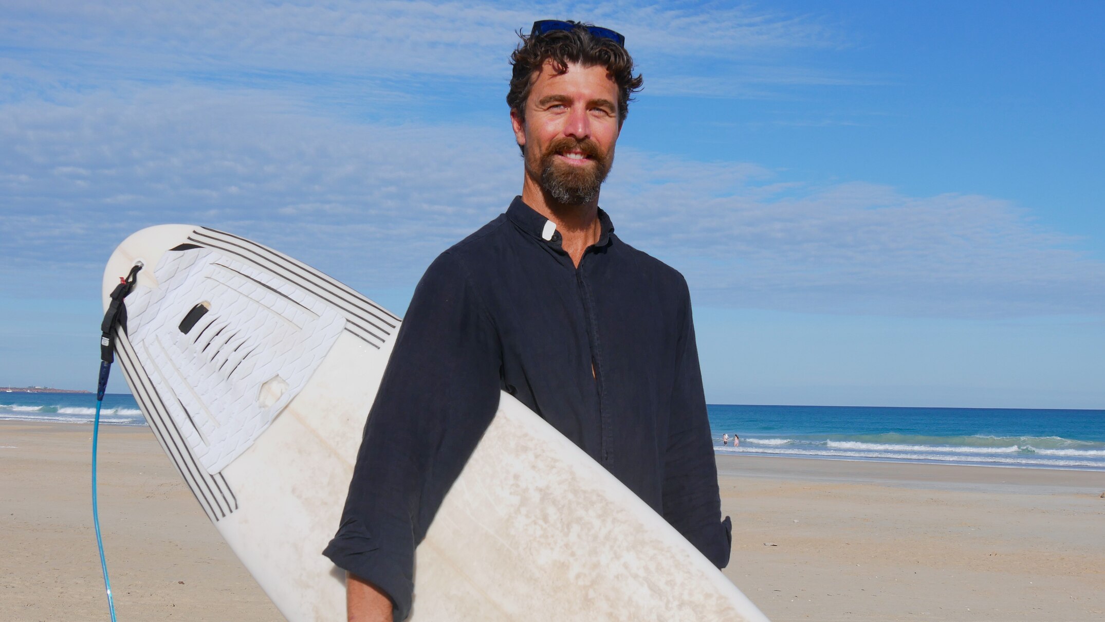 Heroic surfing priest rescues father and son from rip at Cable Beach