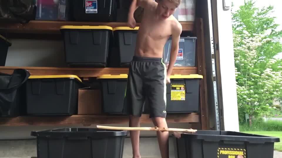 Boy Tries to Break Stick