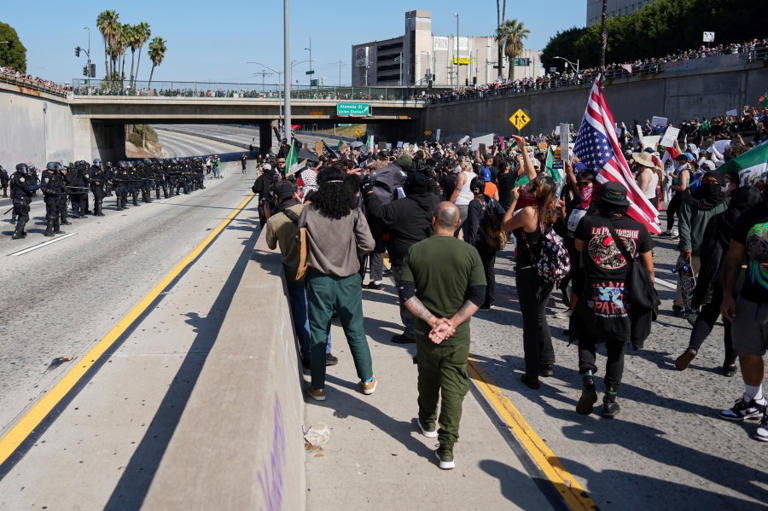 Photos: Protesters confront federal agents, set fires in downtown L.A.
