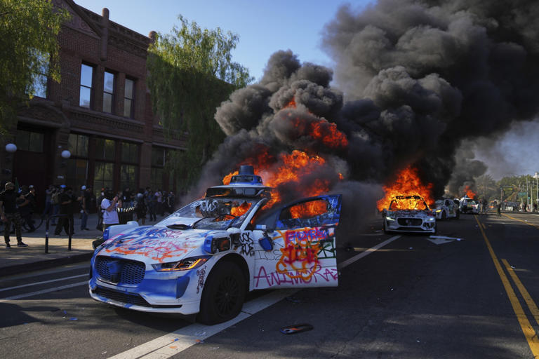 LA protests: Photos show Waymo cars on fire in riots