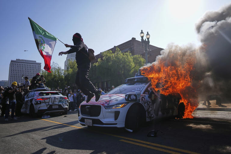 LA protests: Photos show Waymo cars on fire in riots