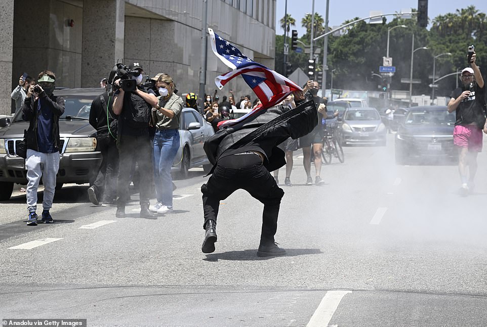 Protester with Mexican flag becomes symbol of Anti-ICE uprising