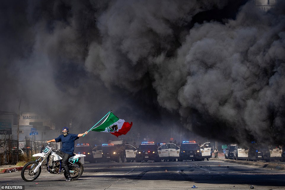 Protester with Mexican flag becomes symbol of Anti-ICE uprising