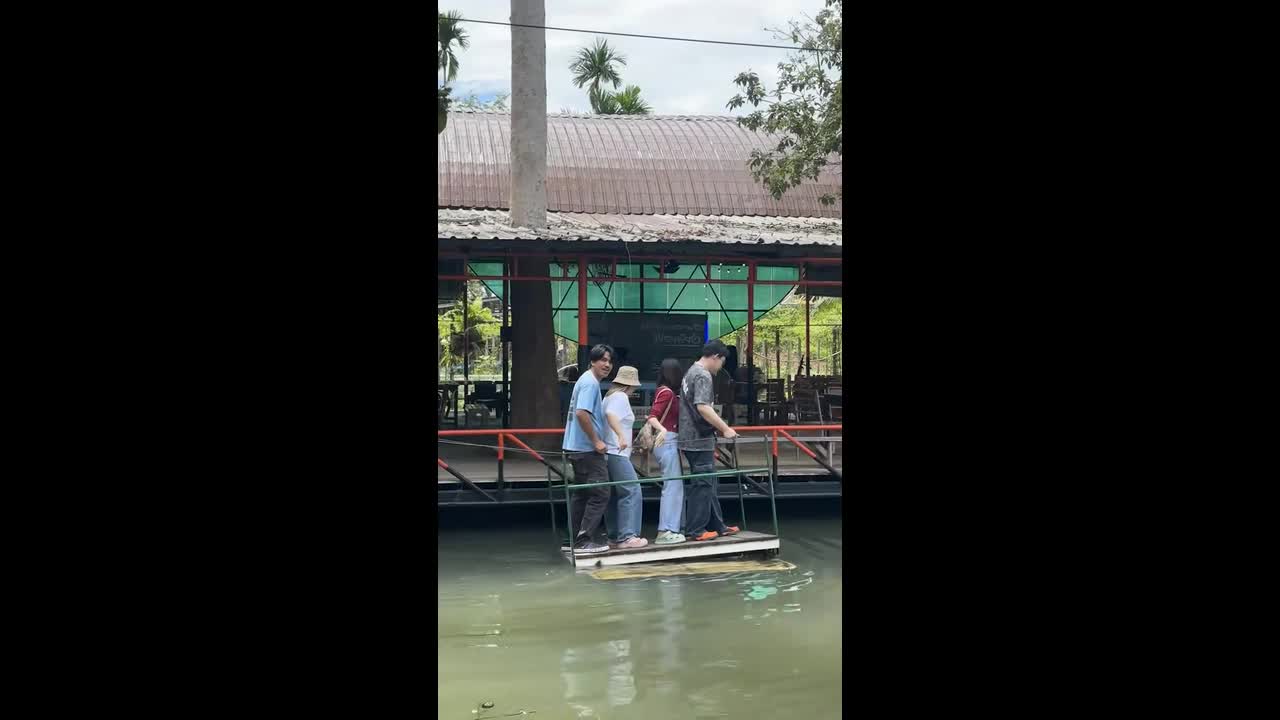 Friends fall into water when raft sinks at cafe in Thailand