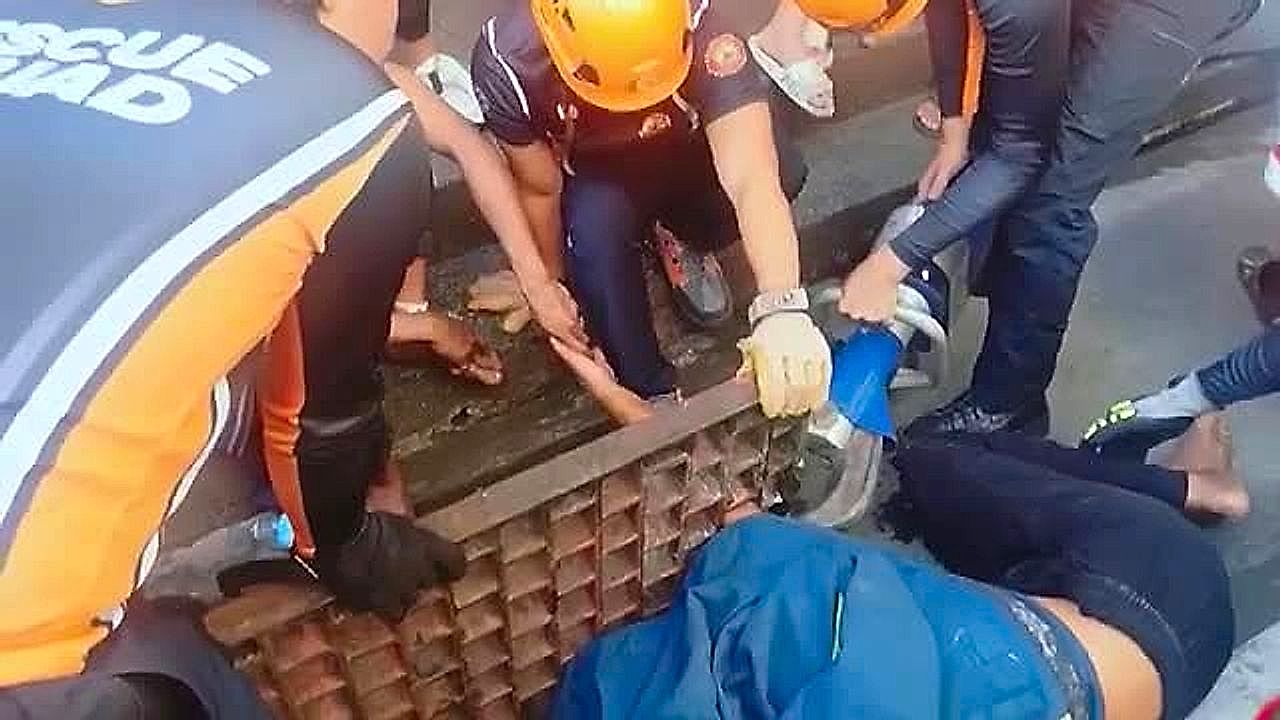Firemen rescue teen trapped in manhole while retrieving coin