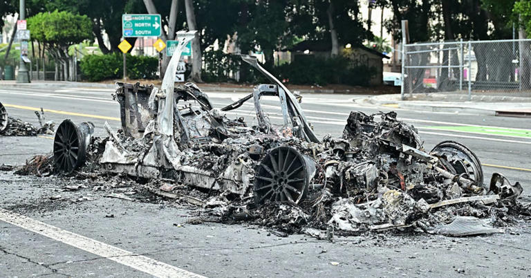 Photos show Waymo vehicles on fire during LA protests as company cuts ...