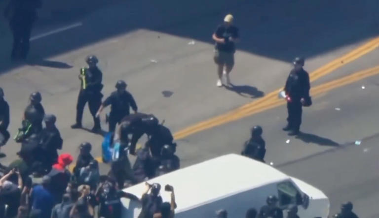 LAPD takes down protester on stilts, drags him away at an anti-ICE riot