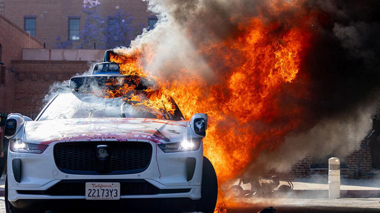 Waymo cars set on fire as Los Angeles immigration raids protests continue