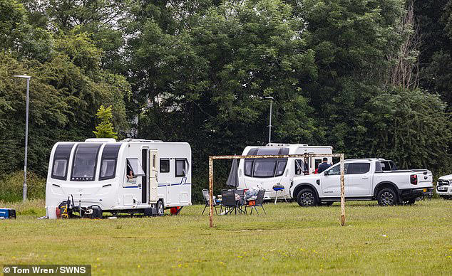 Idyllic town besieged by travellers after three encampments set up in ...