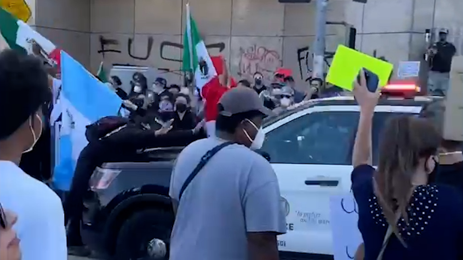 LA protests: Video shows police cars driving through crowd